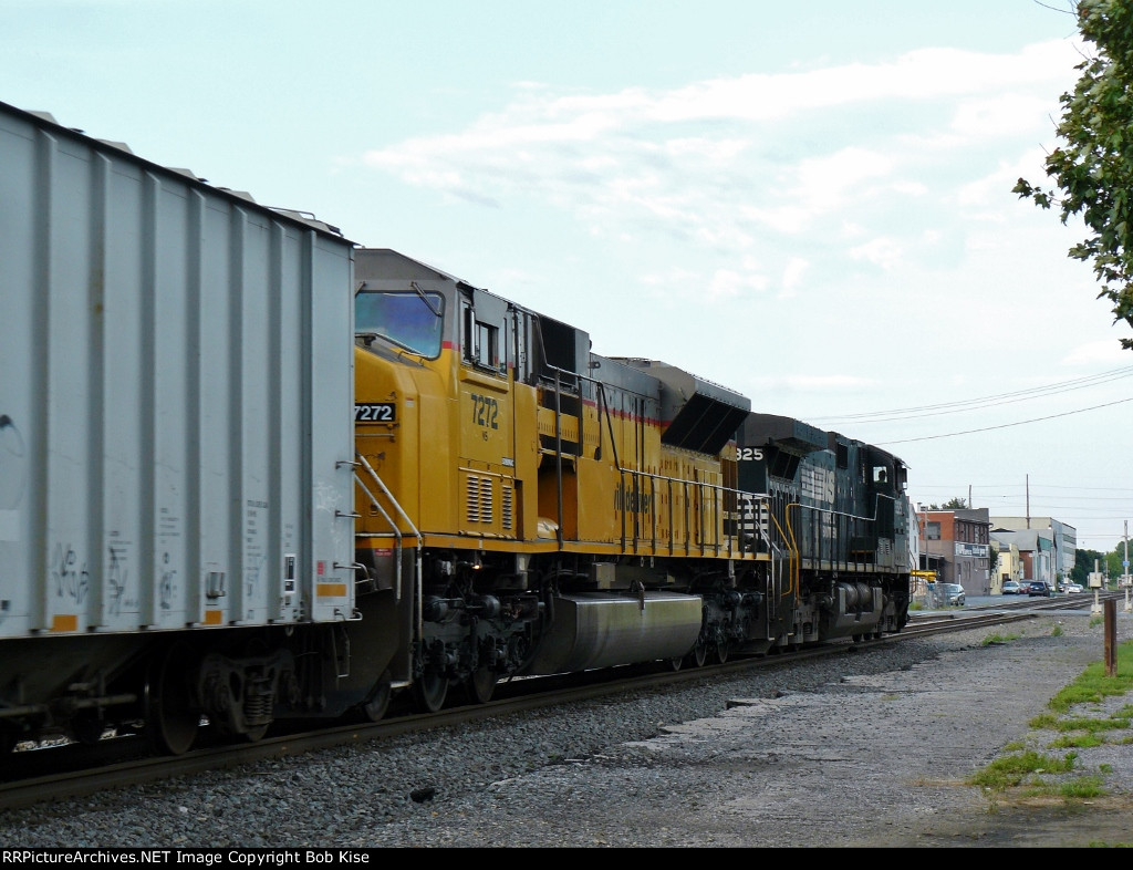 The ex-UP 7272 SD9043MAC trails 64K's leader